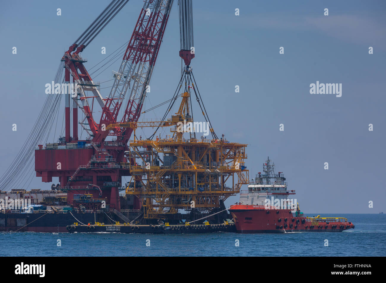 Oil rig lifting for installation on its jacket Stock Photo - Alamy