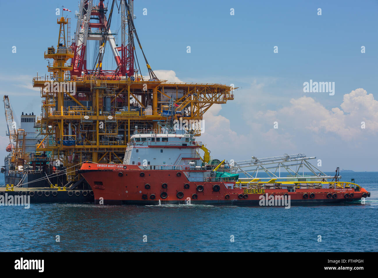 Oil rig lifting for installation on its jacket Stock Photo - Alamy