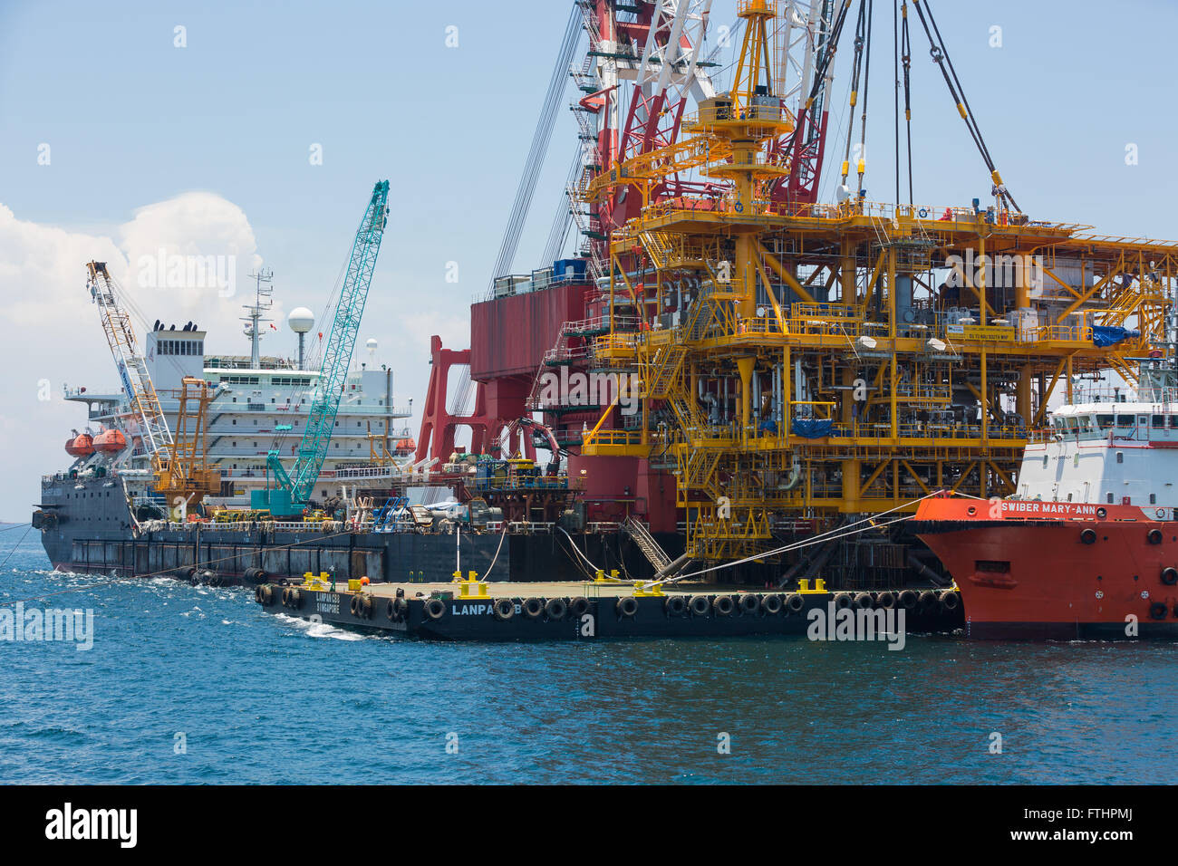 Oil rig lifting for installation on its jacket Stock Photo - Alamy