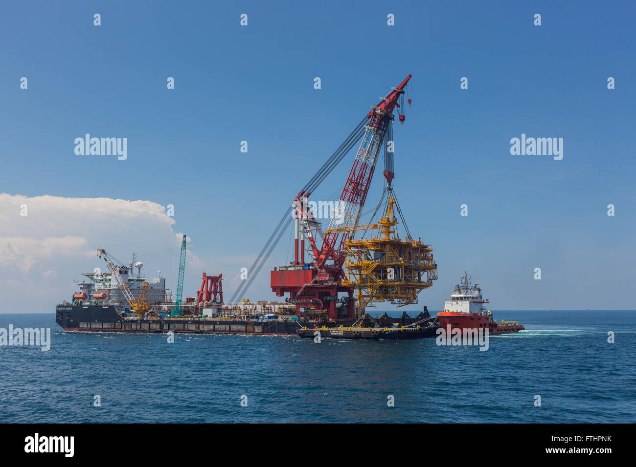 Oil rig lifting for installation on its jacket Stock Photo - Alamy