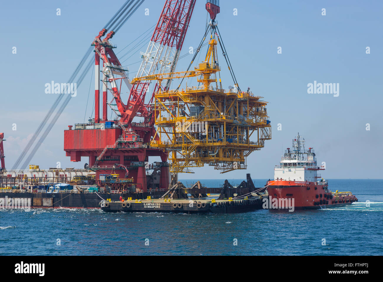 Oil rig lifting for installation on its jacket Stock Photo - Alamy