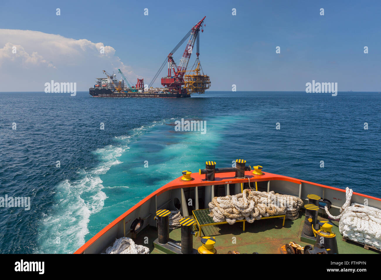 Oil rig lifting for installation on its jacket Stock Photo - Alamy
