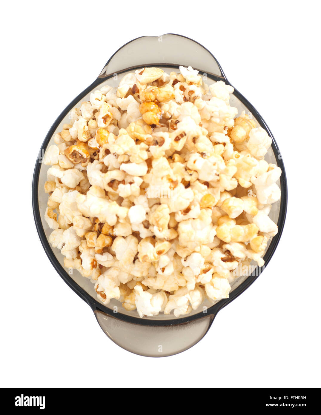 Popcorn in a glass bowl isolated on white Stock Photo - Alamy