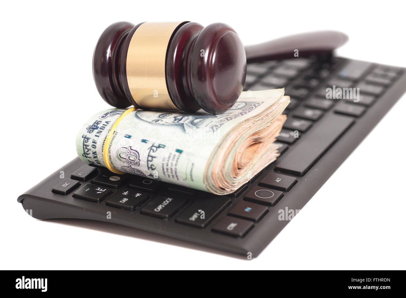 Indian Currency Rupee Notes and Law Gavel on computer keyboard isolated ...