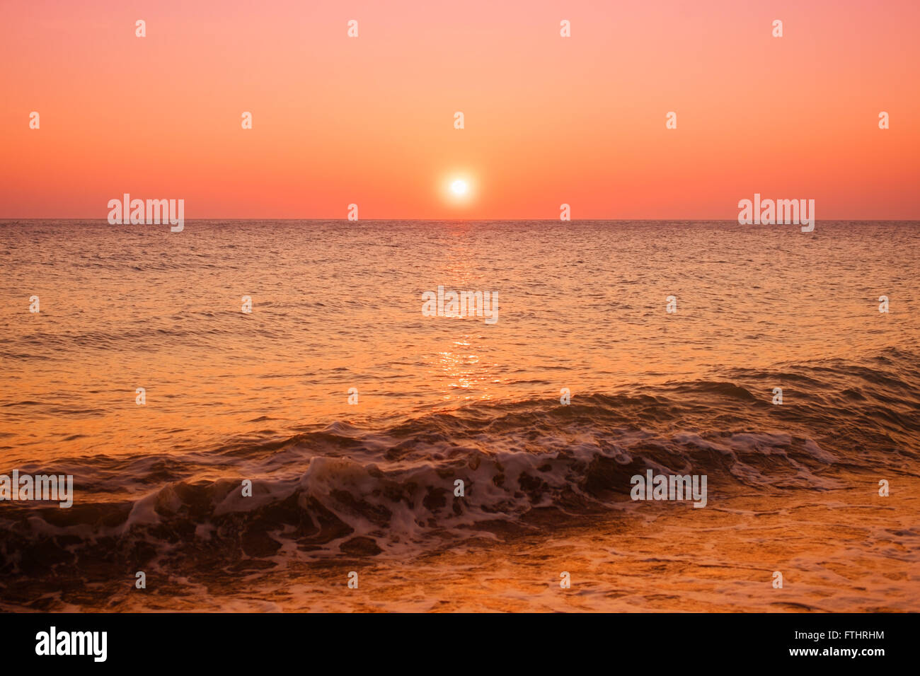 Landscape with beautiful sunset over the ocean Stock Photo - Alamy