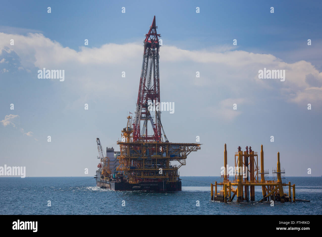 Oil rig lifting for installation on its jacket Stock Photo - Alamy