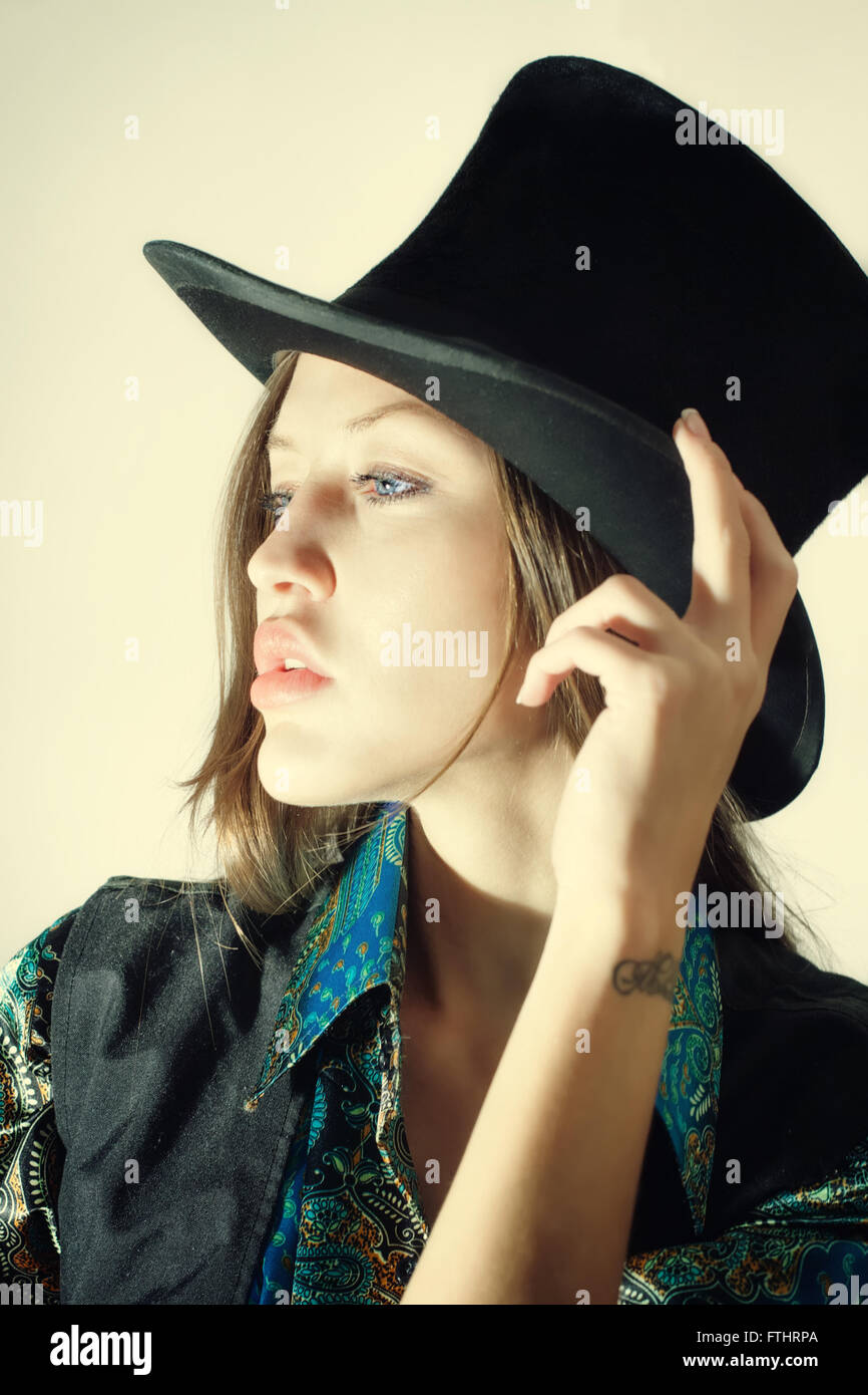 Portrait of beautiful young girl wearing topper Stock Photo - Alamy