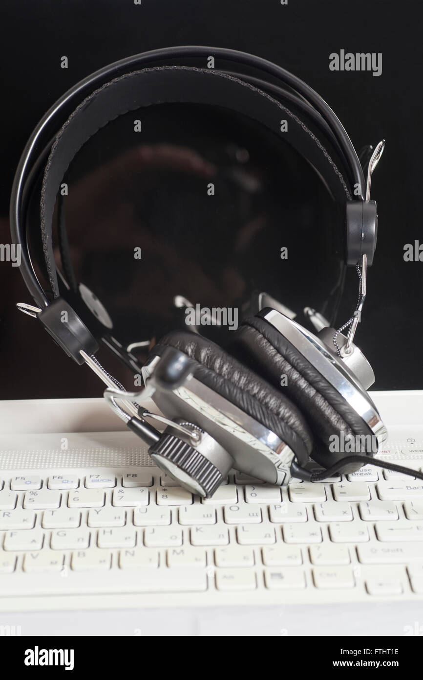 Headset with laptop computer keyboard.Communication concept Stock Photo ...