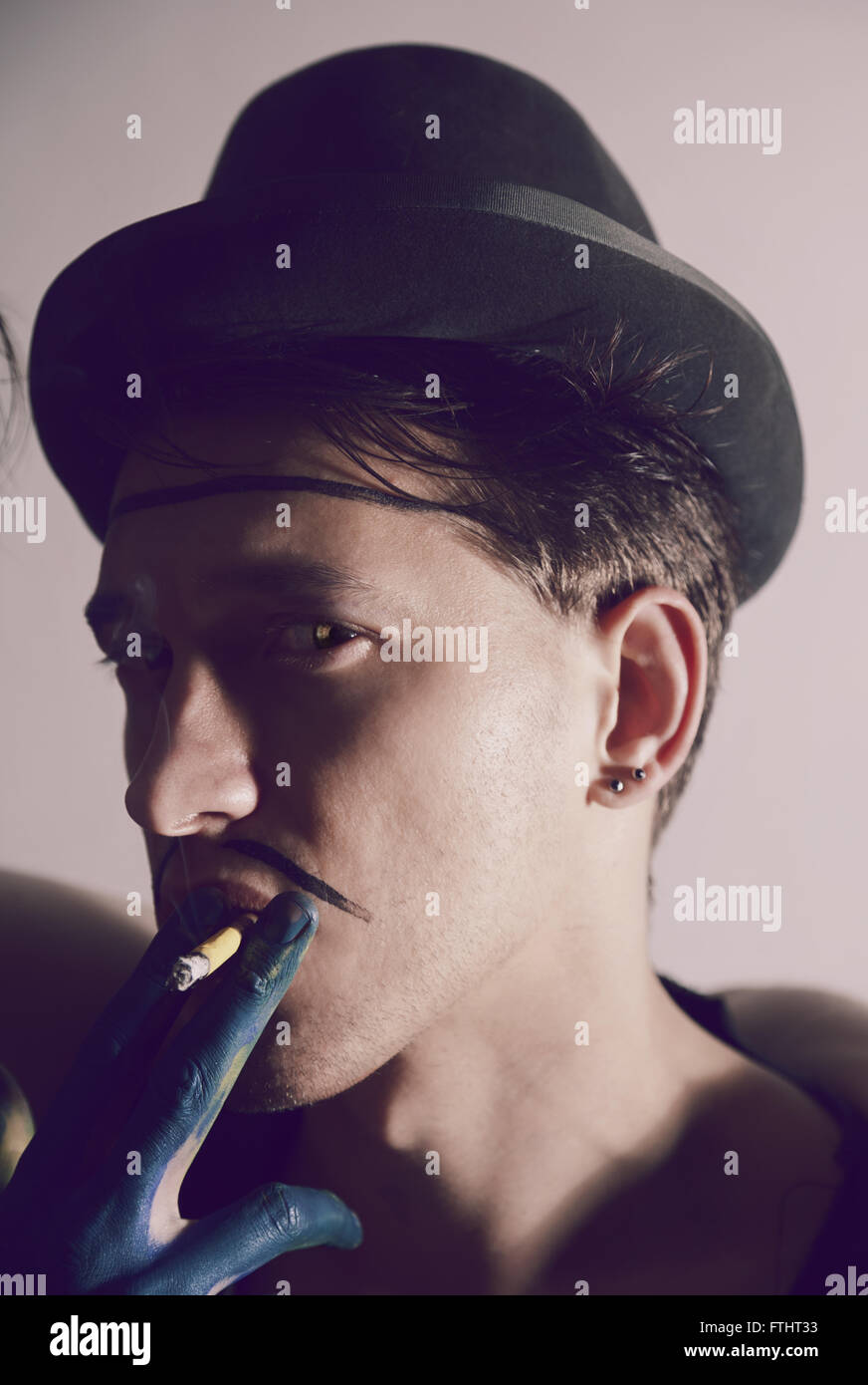 Retro portrait of beautiful young man smoking cigarette Stock Photo - Alamy