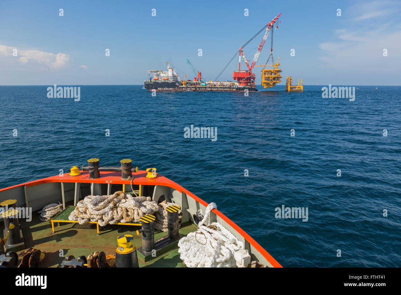 Oil rig lifting for installation on its jacket Stock Photo - Alamy