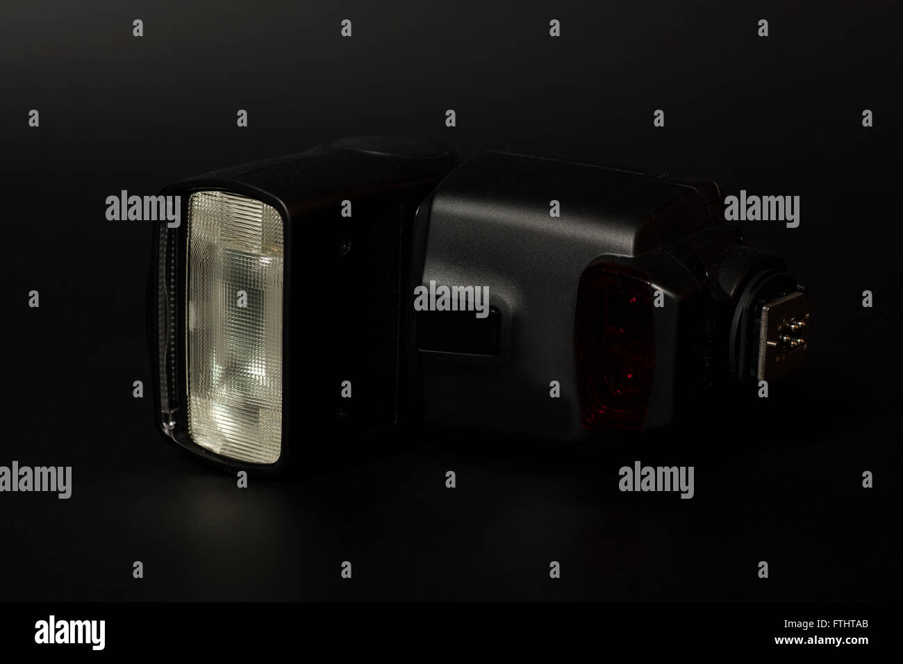 Camera flash on black background Stock Photo - Alamy