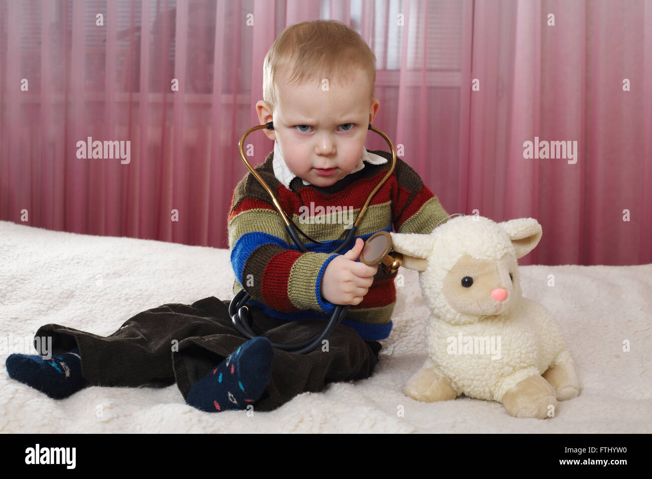 little angry boy playing doctor Stock Photo - Alamy