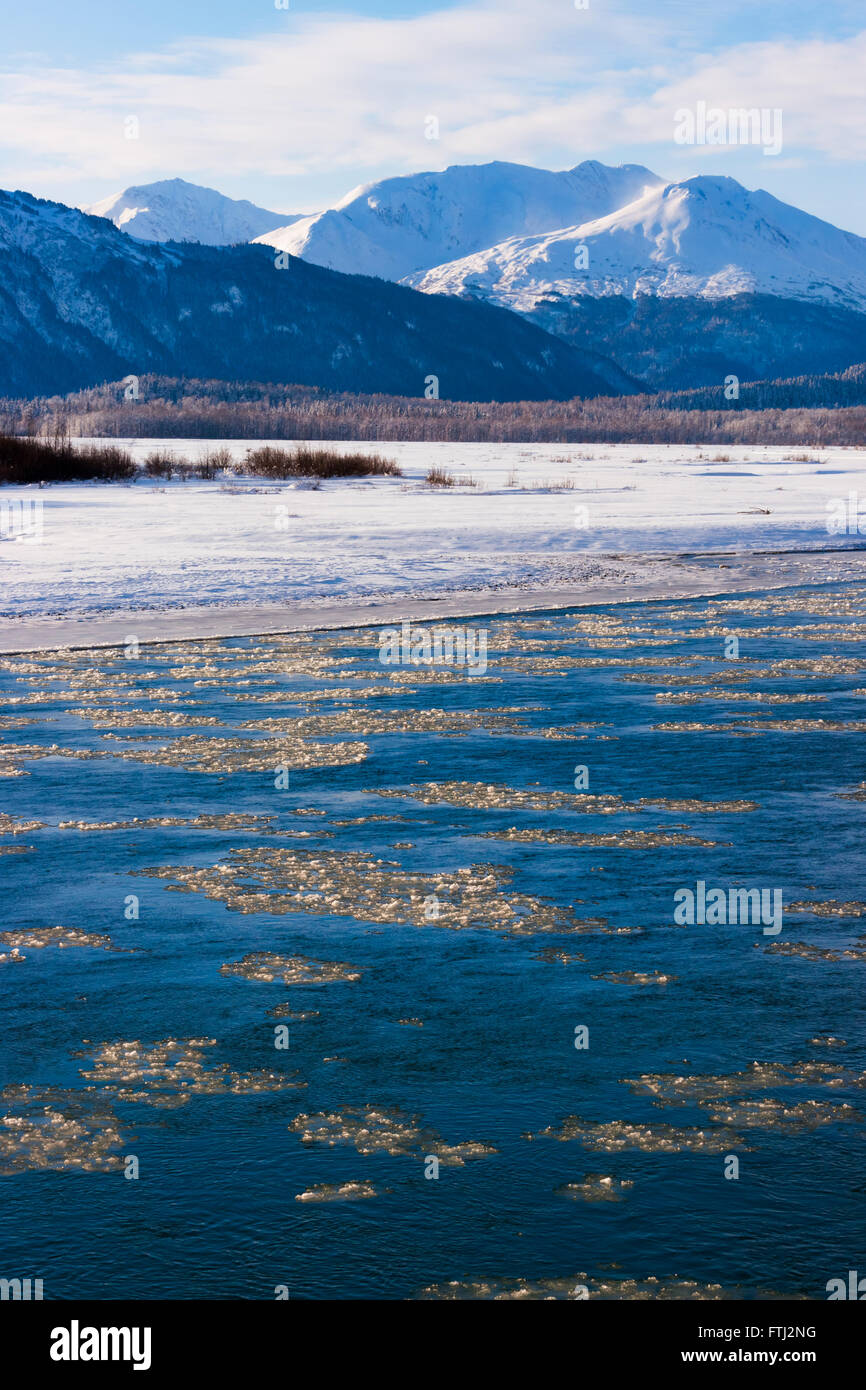 Landscape of river and mountain covered with snow, Haines, Alaska, USA ...