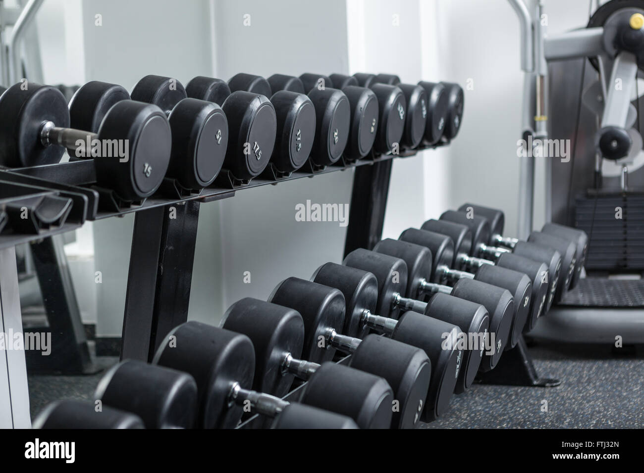 Many dumbbells on rack hi-res stock photography and images - Alamy