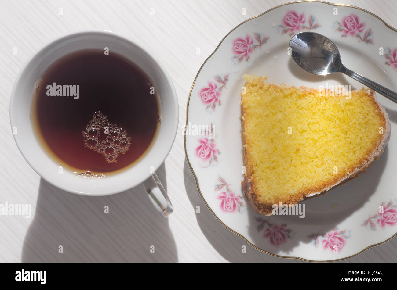 cup of tea and cake on table Stock Photo - Alamy