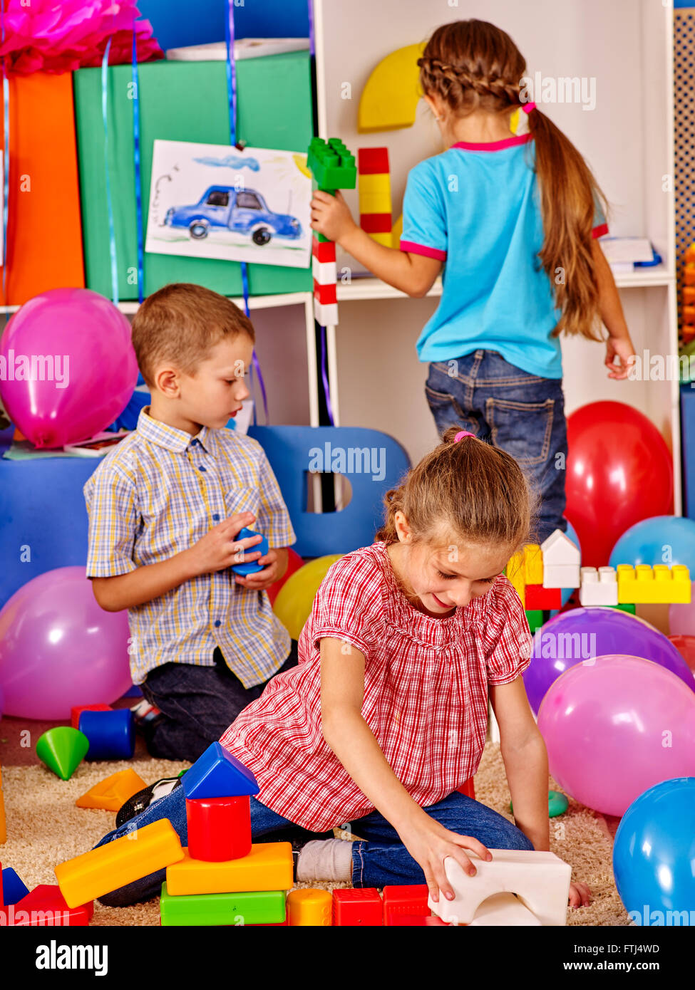 Group children game blocks on floor Stock Photo - Alamy