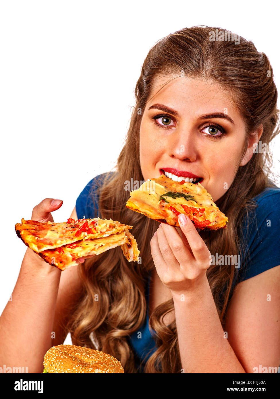 Young beautiful woman eating big pizza Stock Photo - Alamy