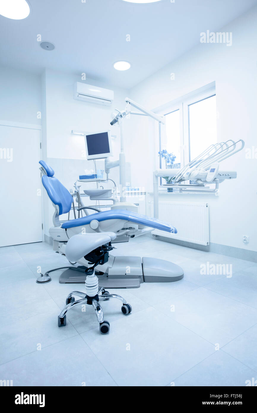 Modern dental practice. Dental chair and other accessories used by ...