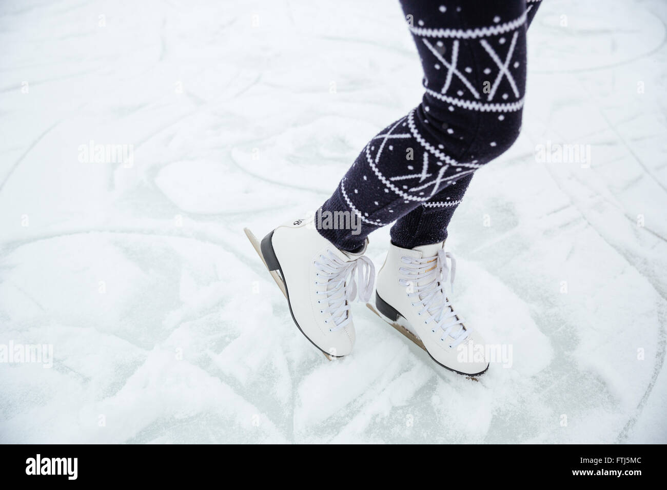 Closeup portrait of a female legs in ice skates Stock Photo - Alamy