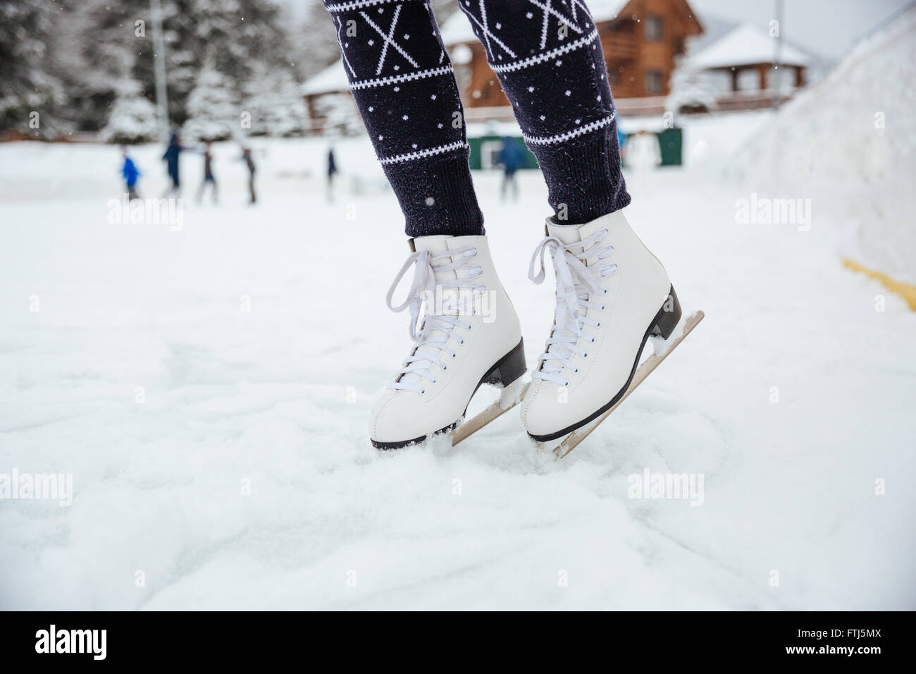 Closeup portrait of a female legs in ice skates Stock Photo - Alamy