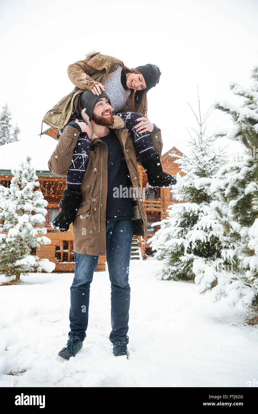 Happy girl sitting on the shoulders of adult male hi-res stock ...