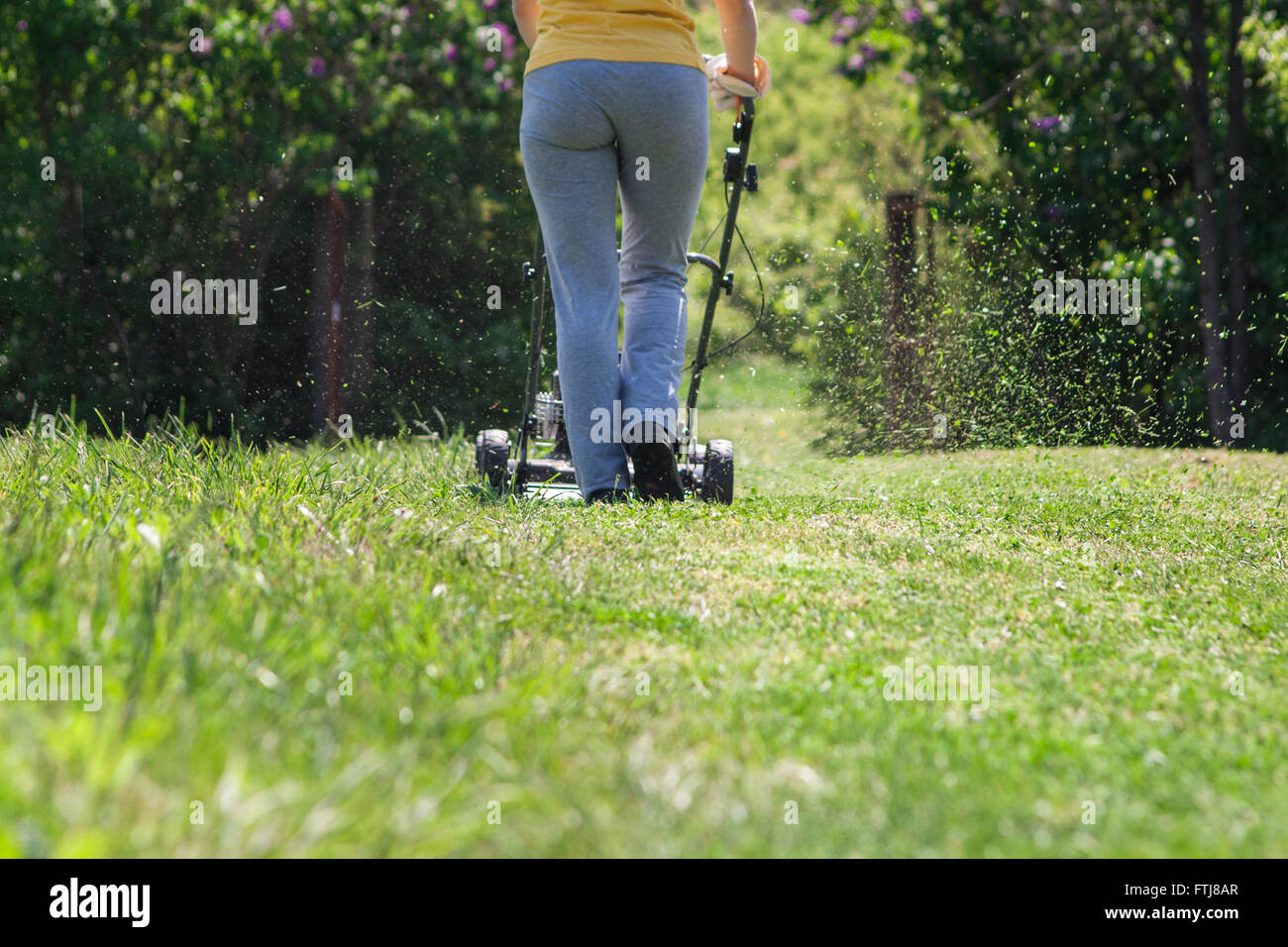 Woman Pushing Lawn Mower High Resolution Stock Photography and Images ...