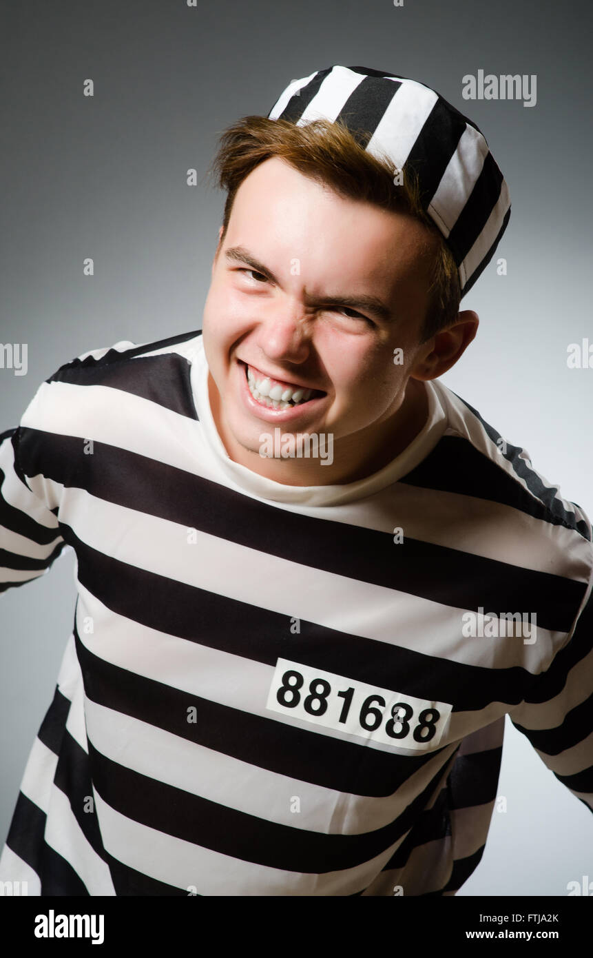 Funny prisoner in prison concept Stock Photo - Alamy