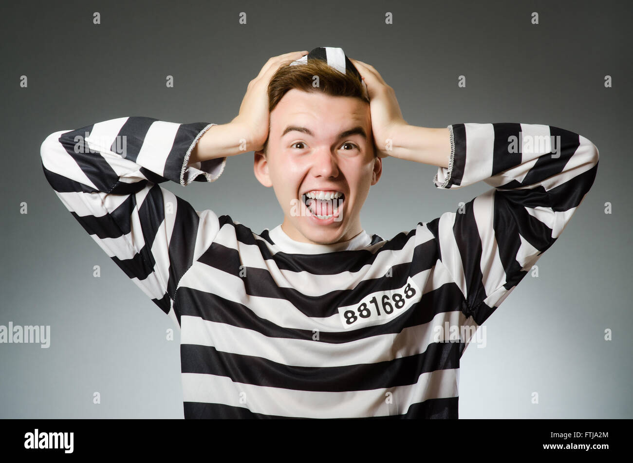 Funny prisoner in prison concept Stock Photo - Alamy