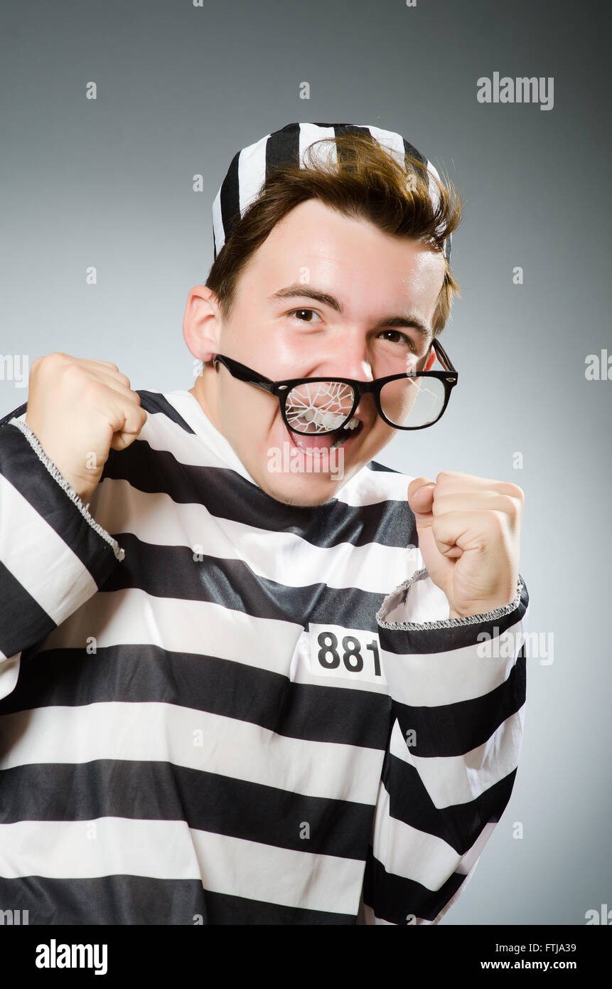 Funny prisoner in prison concept Stock Photo - Alamy