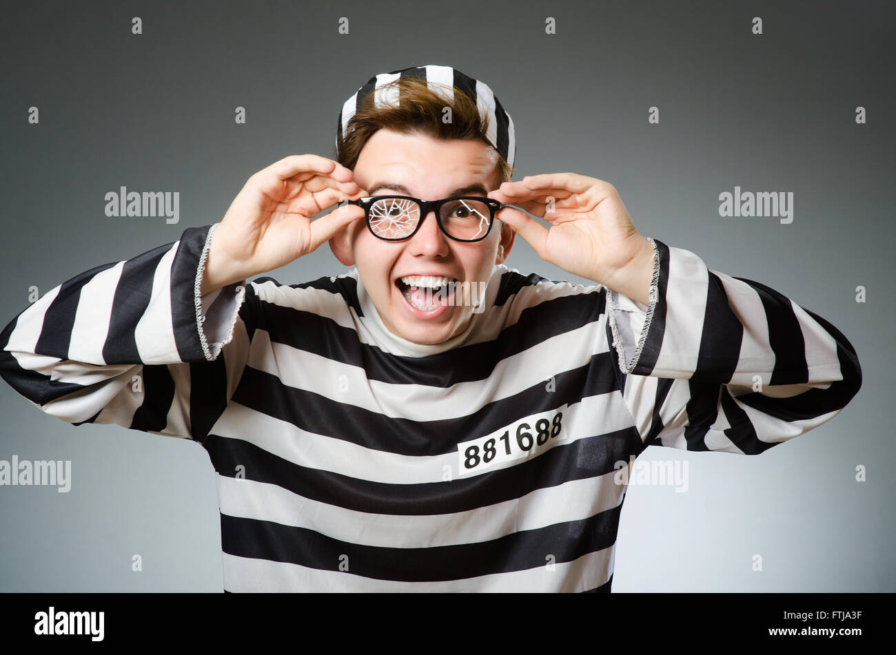 Funny prisoner in prison concept Stock Photo - Alamy