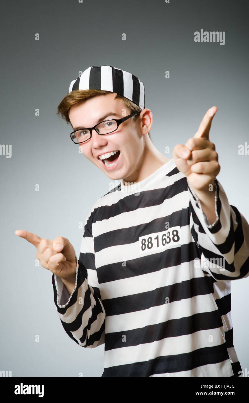 Funny prisoner in prison concept Stock Photo - Alamy