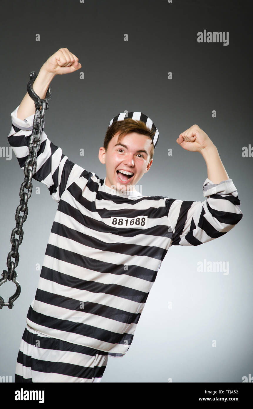 Funny prisoner in prison concept Stock Photo - Alamy