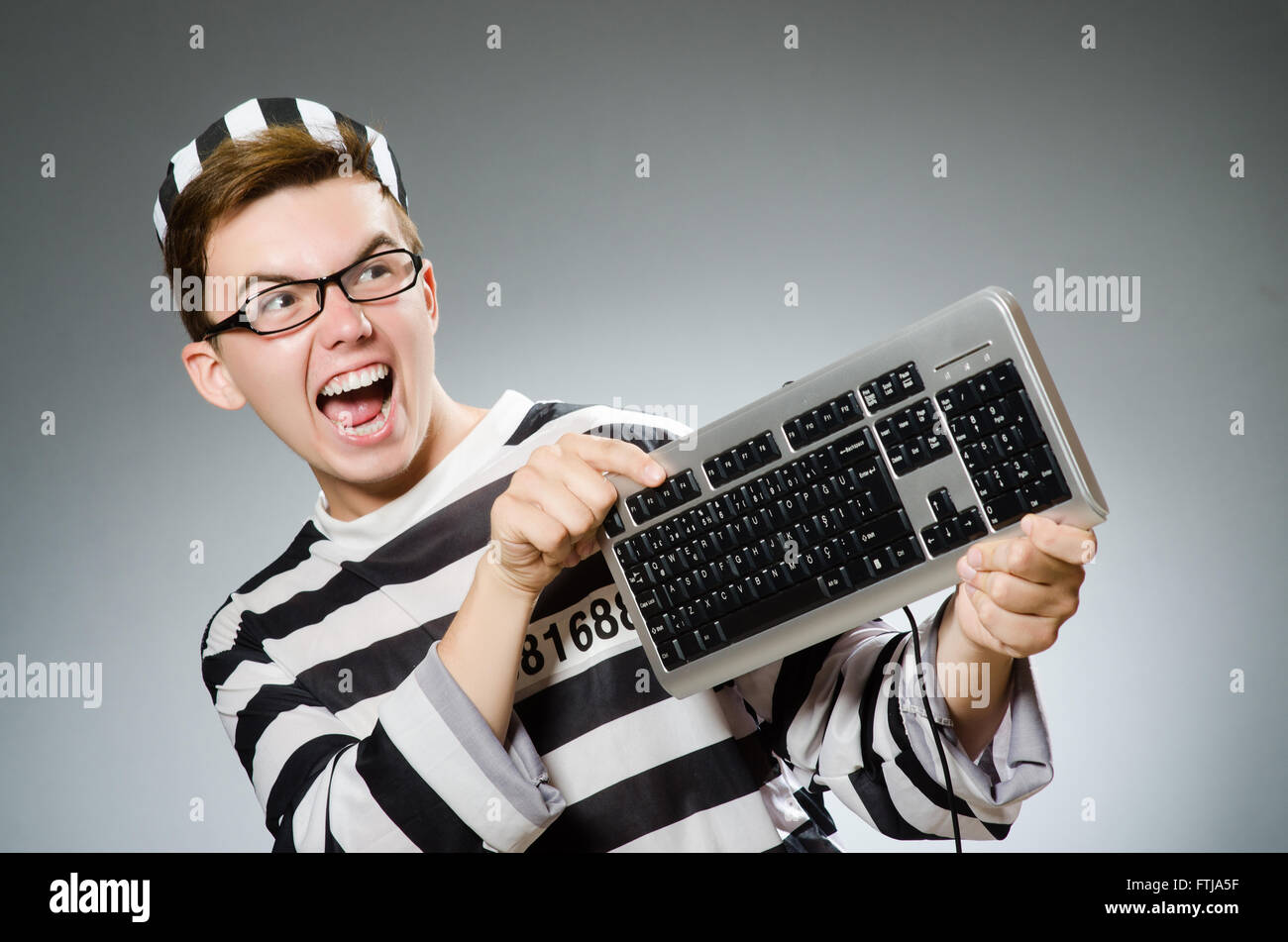Funny prisoner in prison concept Stock Photo - Alamy