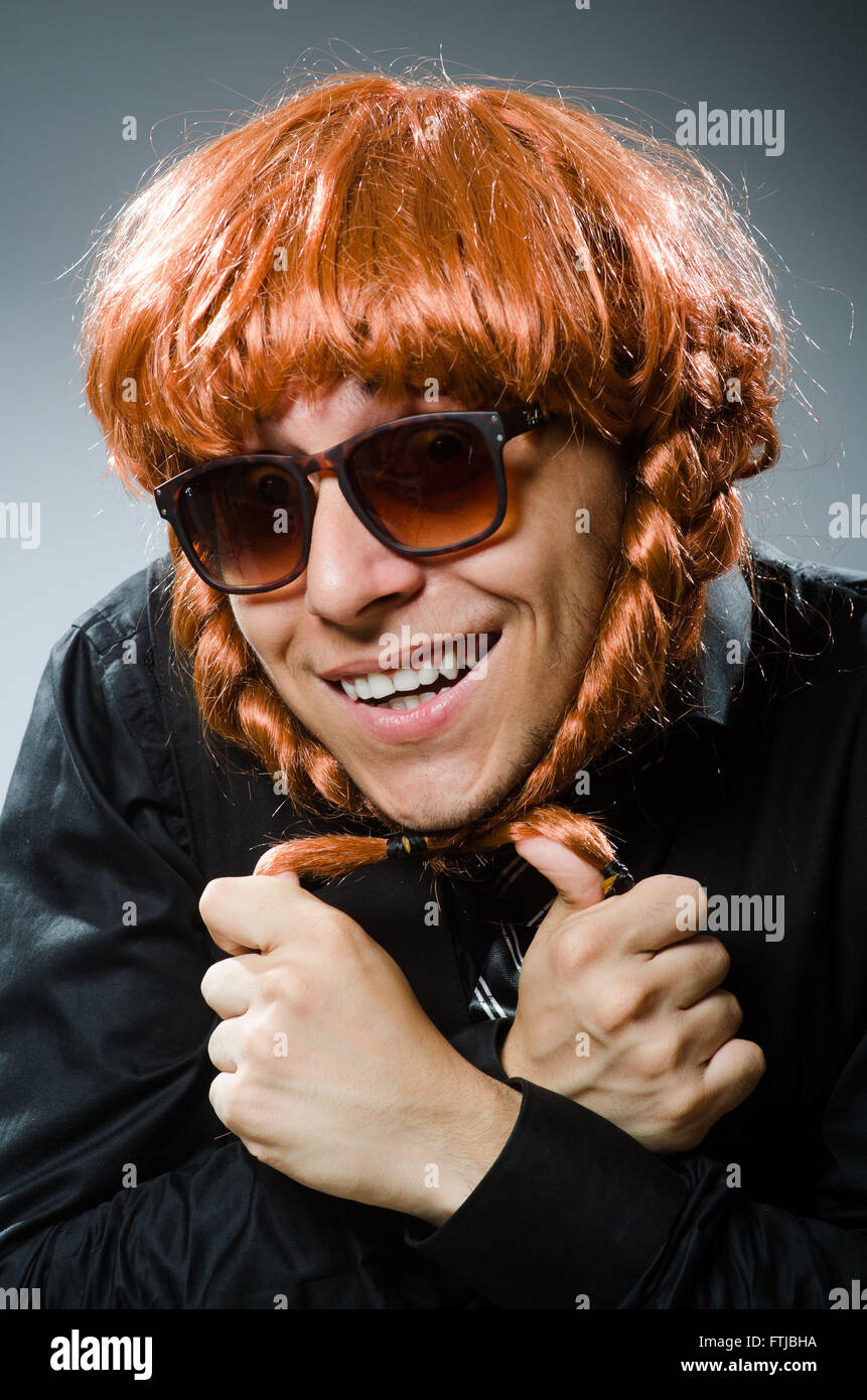 Funny man with red hair wig Stock Photo - Alamy