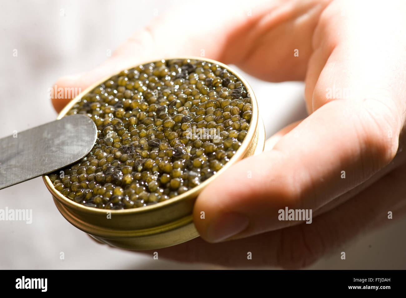 Tin of caviar, Serving caviar, Luxury Stock Photo - Alamy