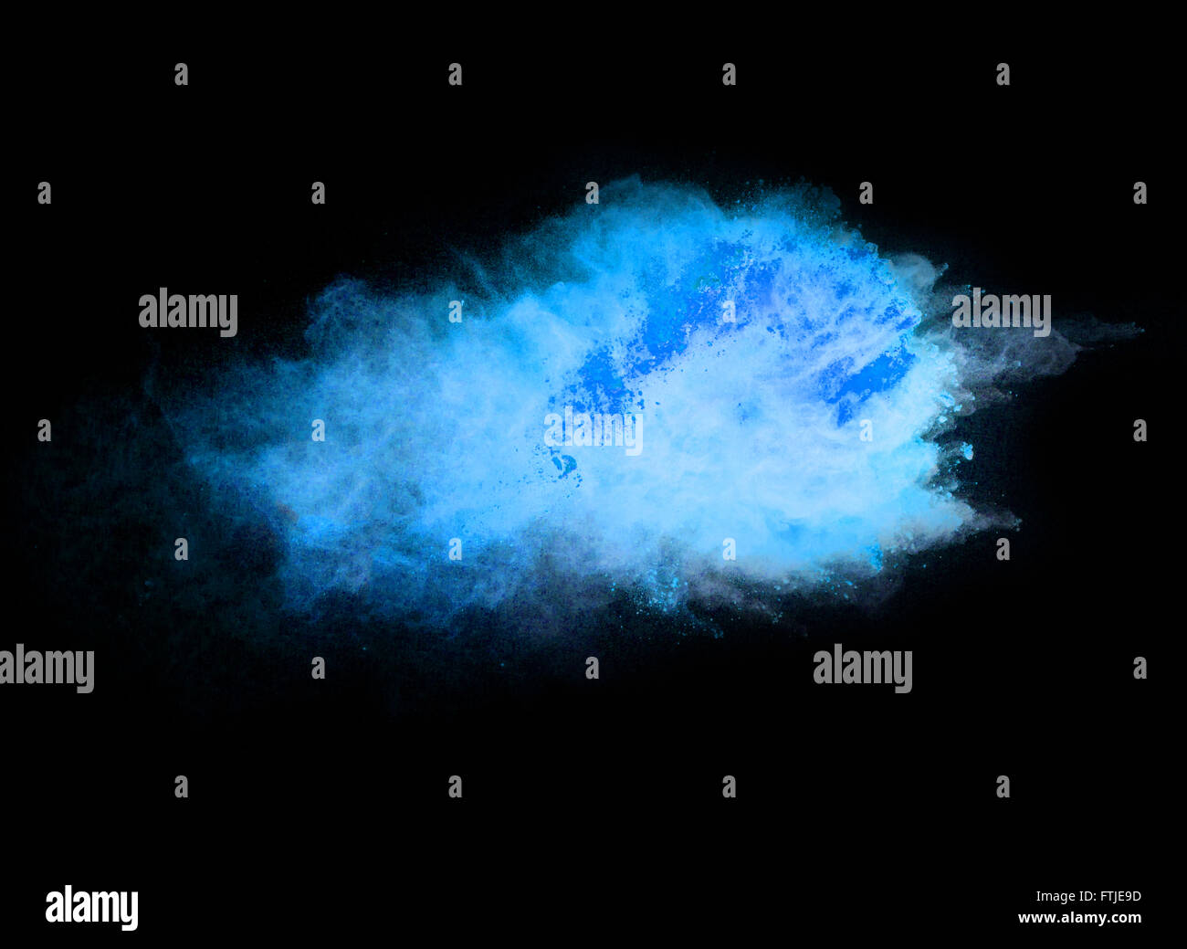 Explosion of blue powder on black background Stock Photo - Alamy