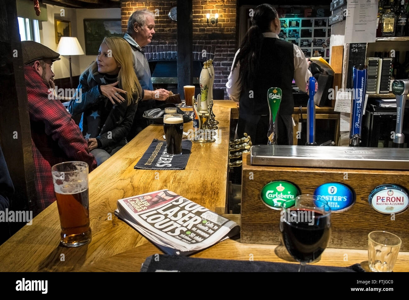 Customers drinking in a traditional English pub in Essex Stock Photo ...