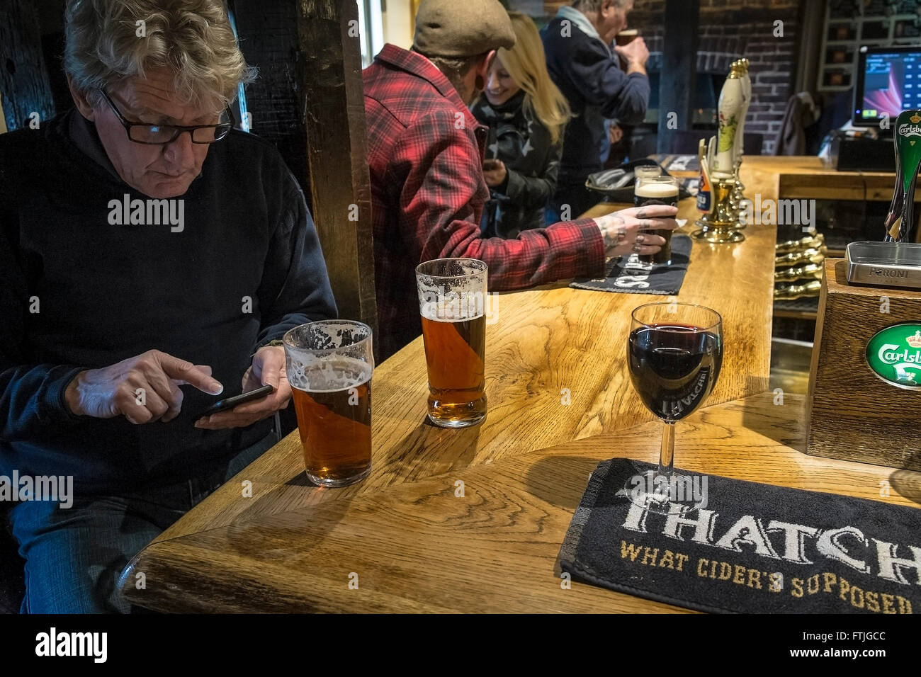 Customers drinking in a traditional English pub in Essex Stock Photo ...