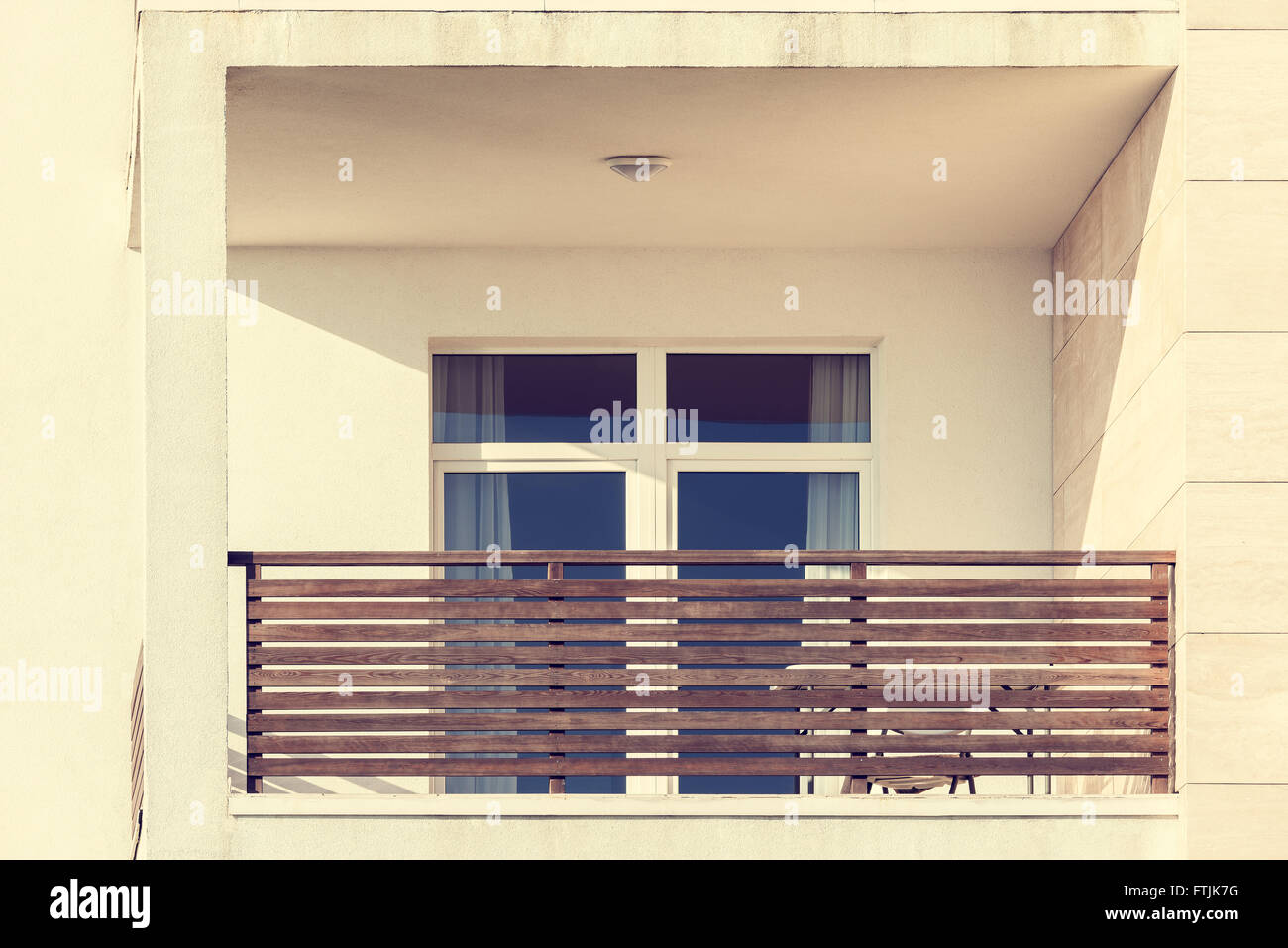 Windows and balconies of the new townhouse at sunset time Stock Photo ...