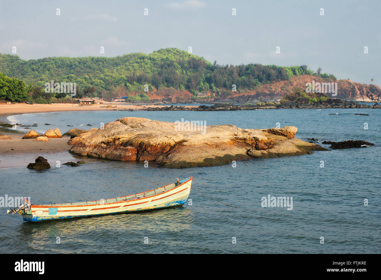 Landscape with old boat on Om beach. India, Karnataka, Gokarna Stock ...