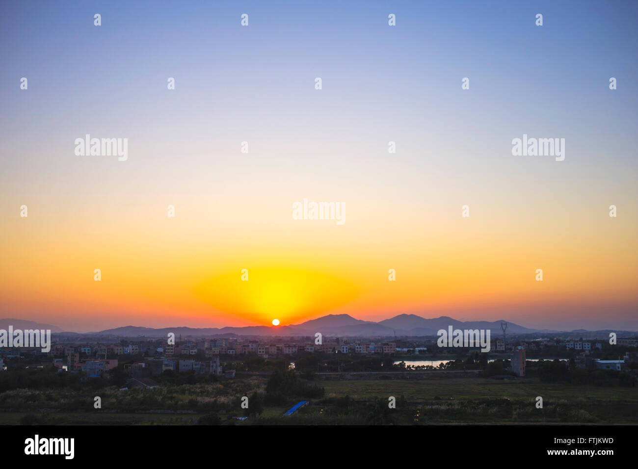 Town at dusk sunset is very beautiful Stock Photo - Alamy