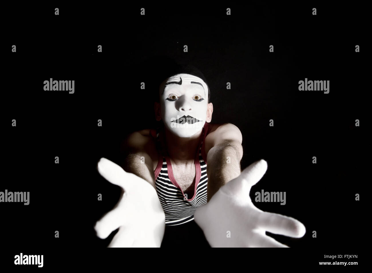 Portrait of sad mime on black background Stock Photo - Alamy