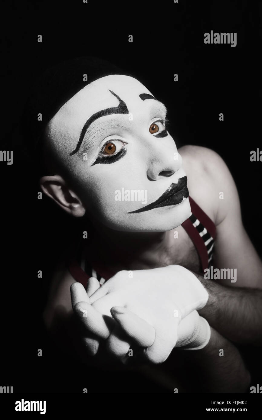 Portrait of sad mime on black background Stock Photo - Alamy
