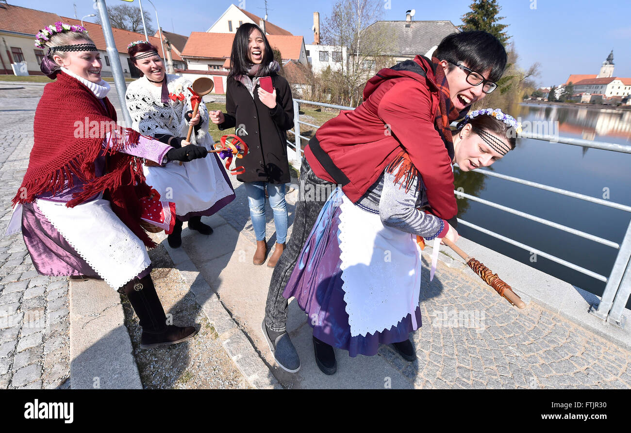 Telc, Czech Republic. 28th Mar, 2016. Young women in folk costume whip ...