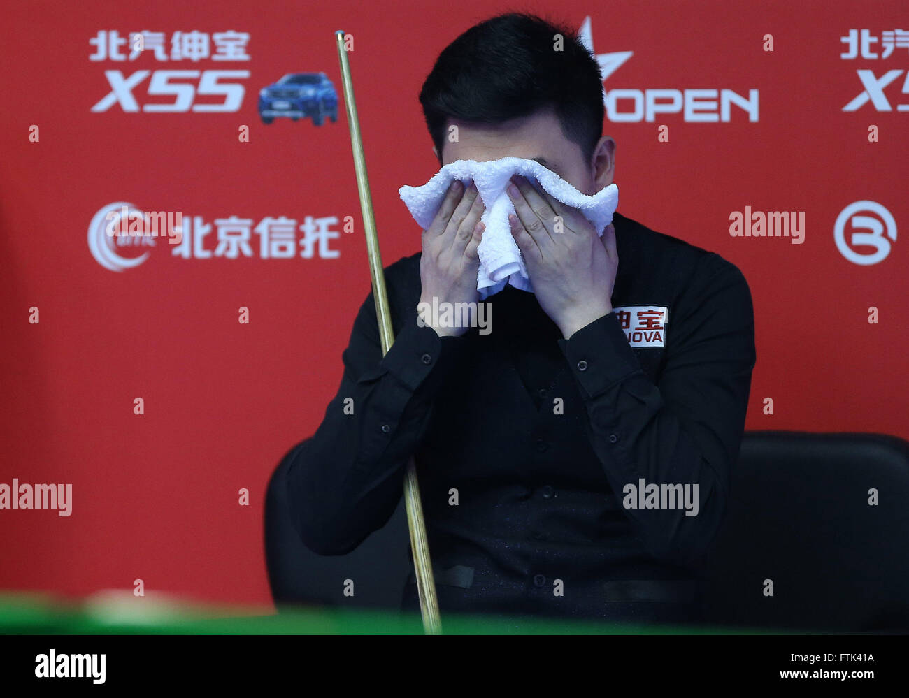 Beijing, China. 30th Mar, 2016. Tian Pengfei of China reacts during the ...