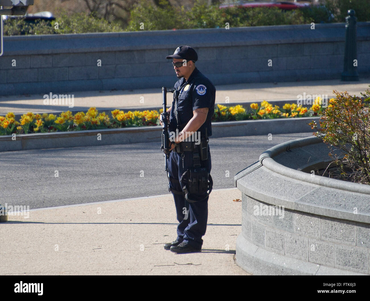 An armed United States Capitol police officer stands guard on the House ...