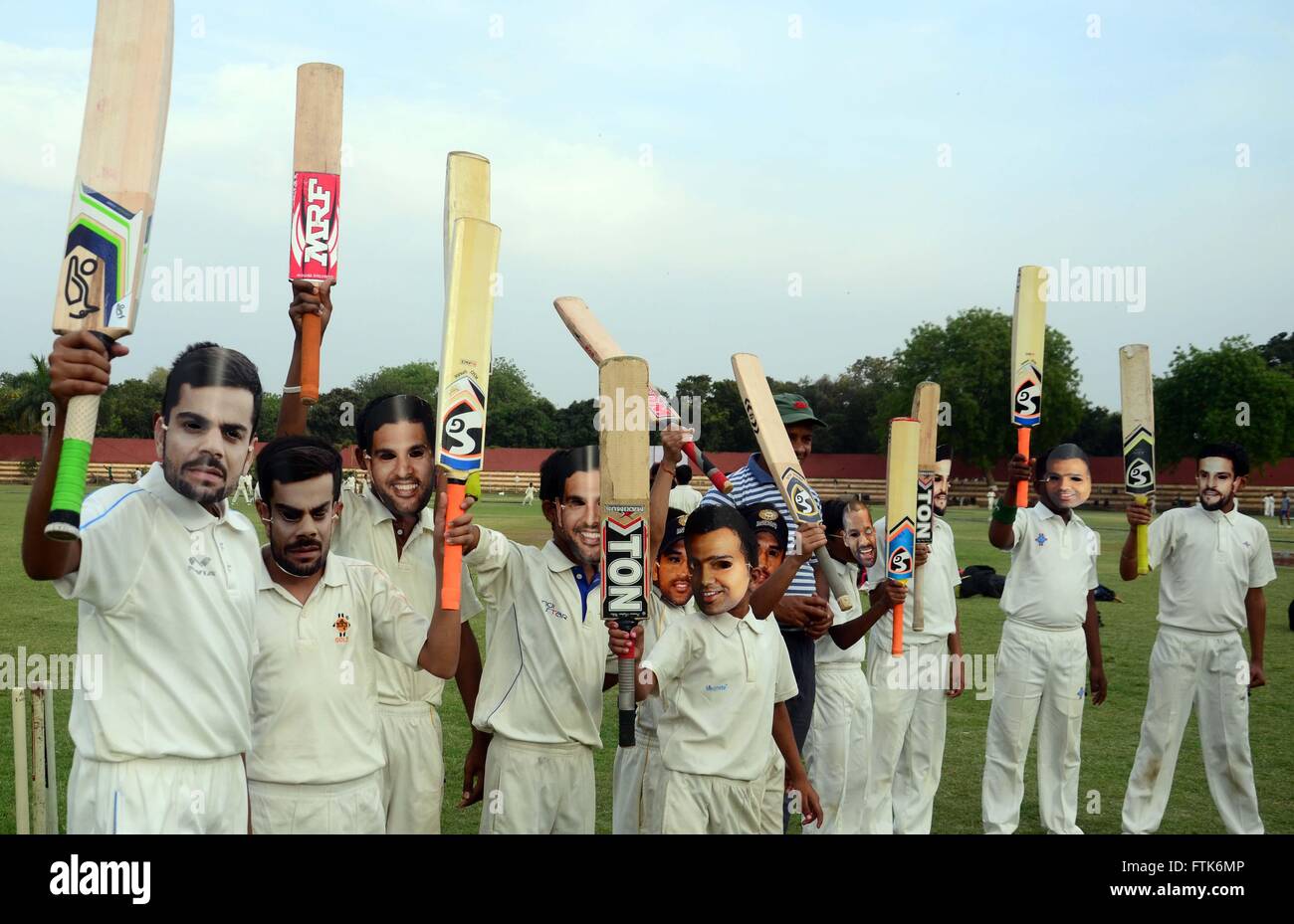 Children wear mask of Indian Cricket players during their practice for ...