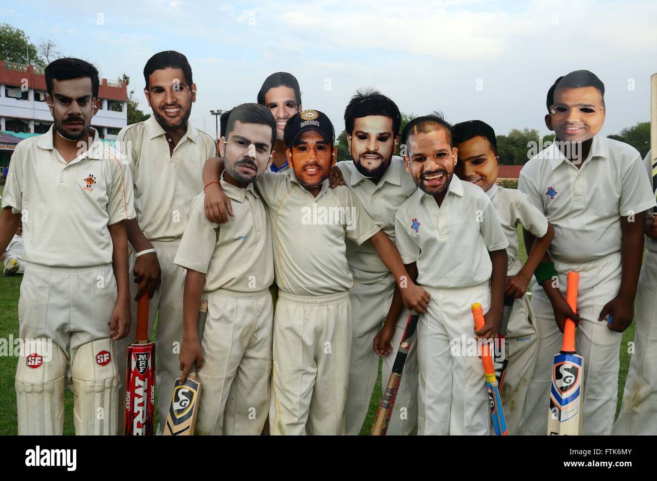 Children wear mask of Indian Cricket players during their practice for ...