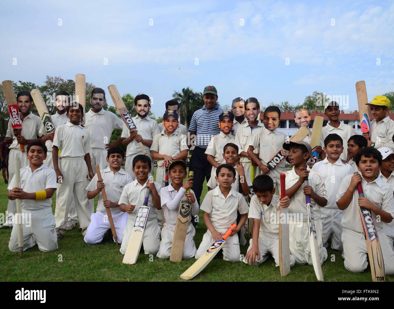 Children wear mask of Indian Cricket players during their practice for ...