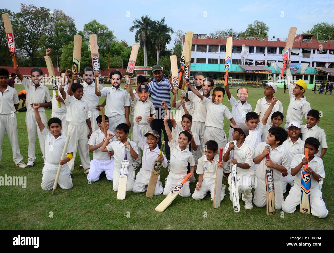 Children wear mask of Indian Cricket players during their practice for ...